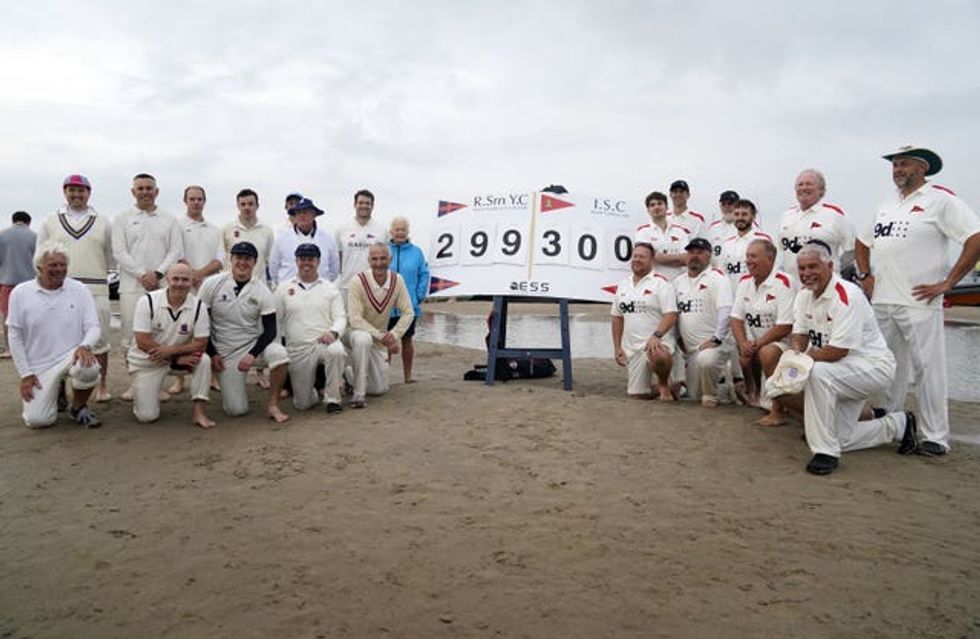 In Pictures: Waves stop play for Solent sandbar cricketers | indy100