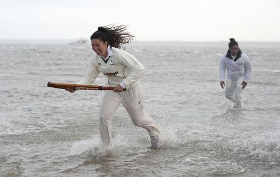 In Pictures: Waterlogged pitch perfect for cricketers playing annual ...