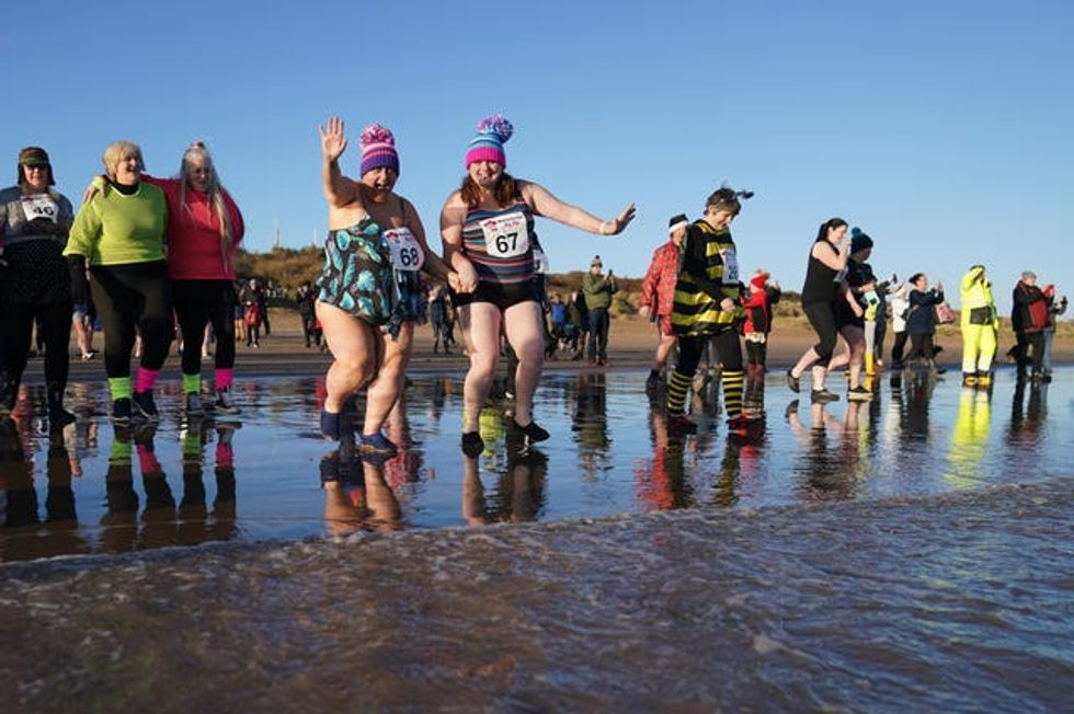 In Pictures: Revellers take the plunge with New Year’s Day dip in icy ...