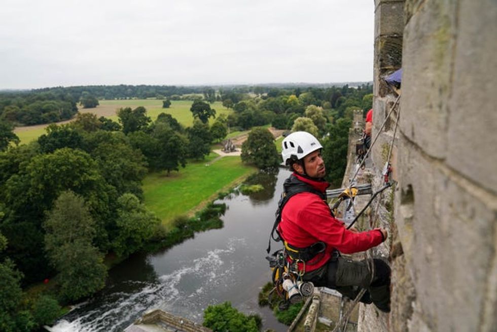 In Pictures: Abseiling experts give Warwick Castle a clean-up | indy100