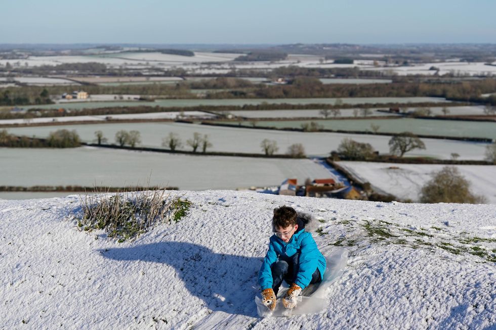 In Pictures: Snow day fun as bitterly cold snap grips the UK | indy100