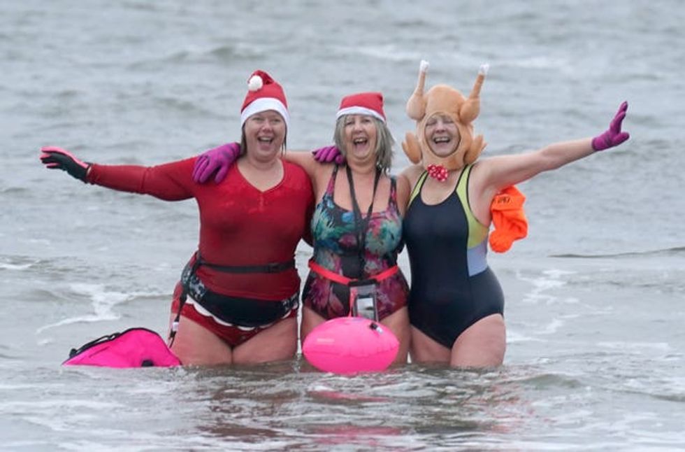 In Pictures: Hardy swimmers and royal watchers brave cold Christmas Day ...