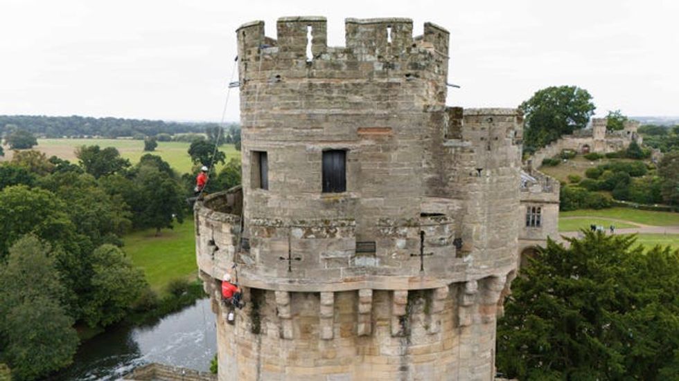 In Pictures: Abseiling experts give Warwick Castle a clean-up | indy100