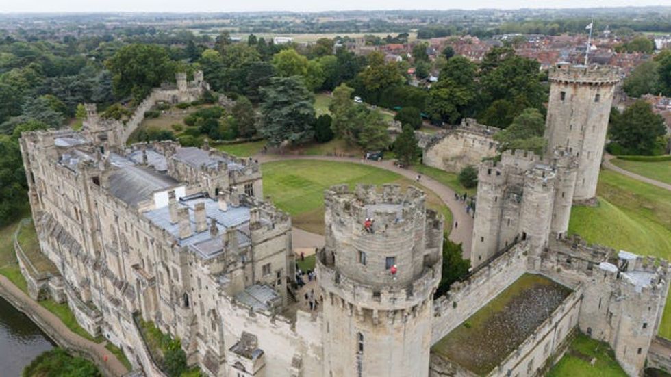 In Pictures: Abseiling experts give Warwick Castle a clean-up | indy100
